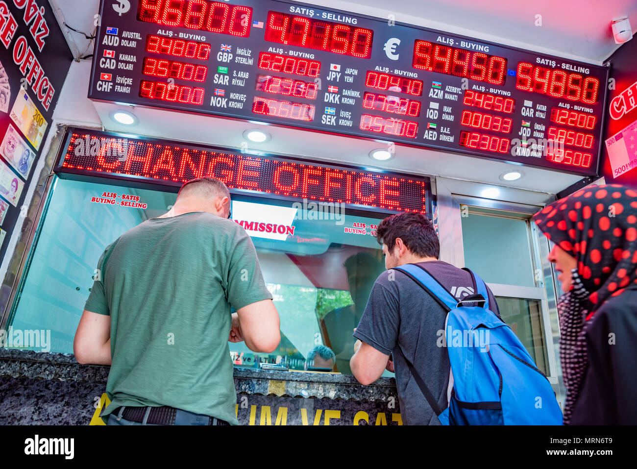 Unidentified people change currency at money changer shop in Istanbul ...