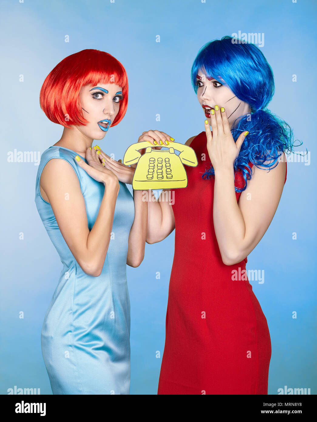 Portrait of young women in comic pop art make-up style. Females in red ...