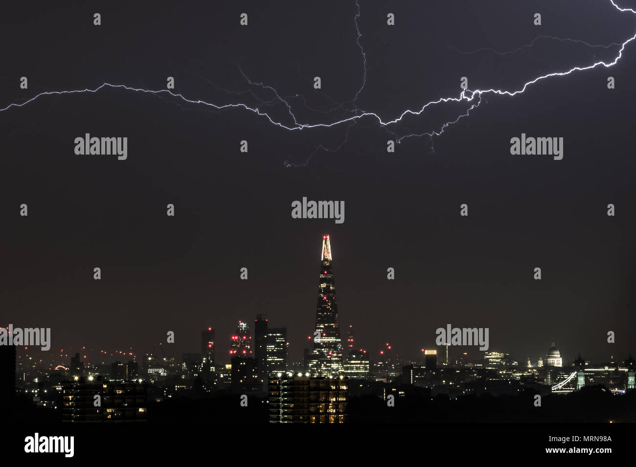 London, UK. 27th May, 2018. UK Weather: Lightning strike over The Shard ...