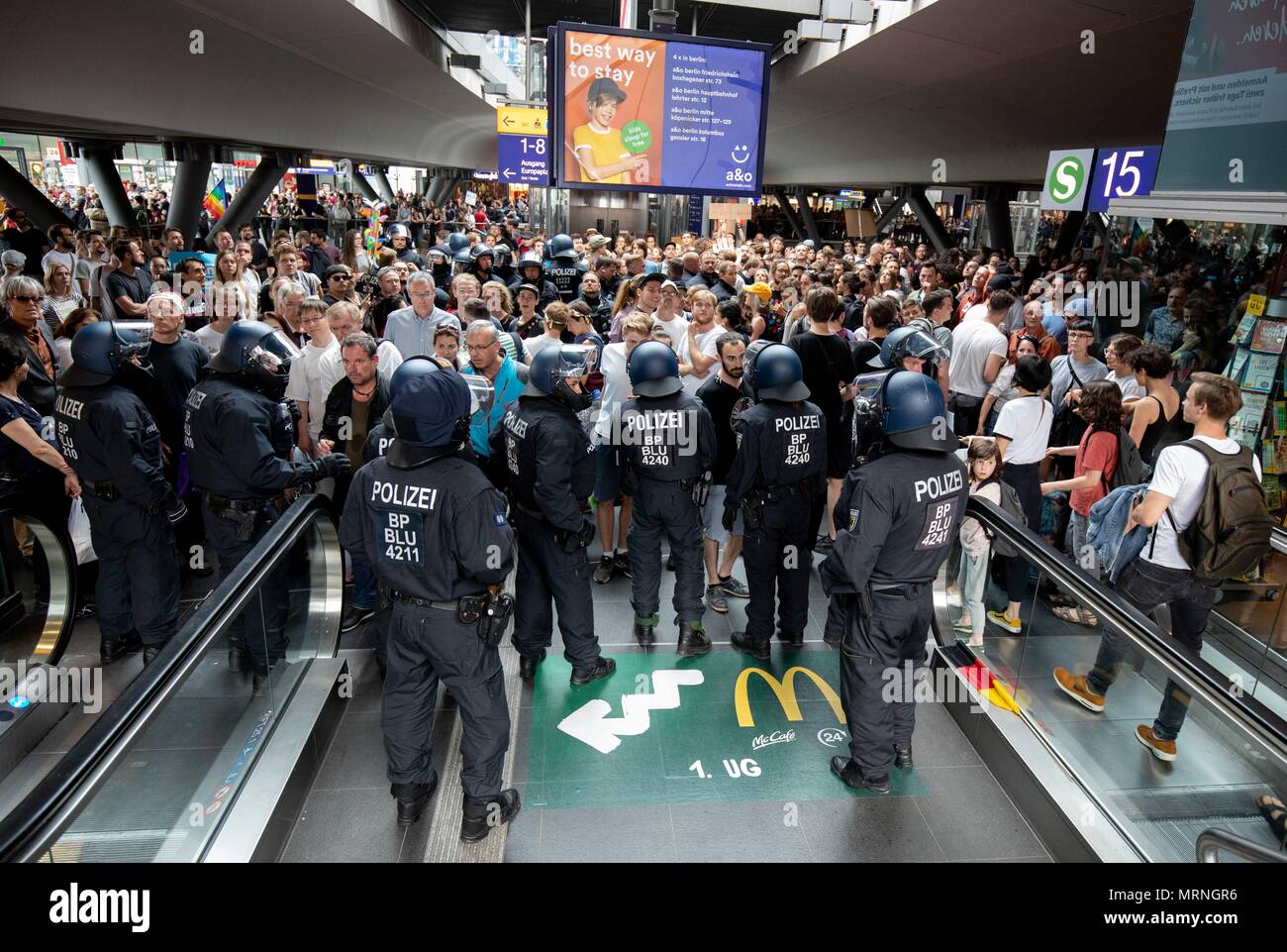 27 May 2018, Germany, Berlin: Counter-protestors gather inside the ...