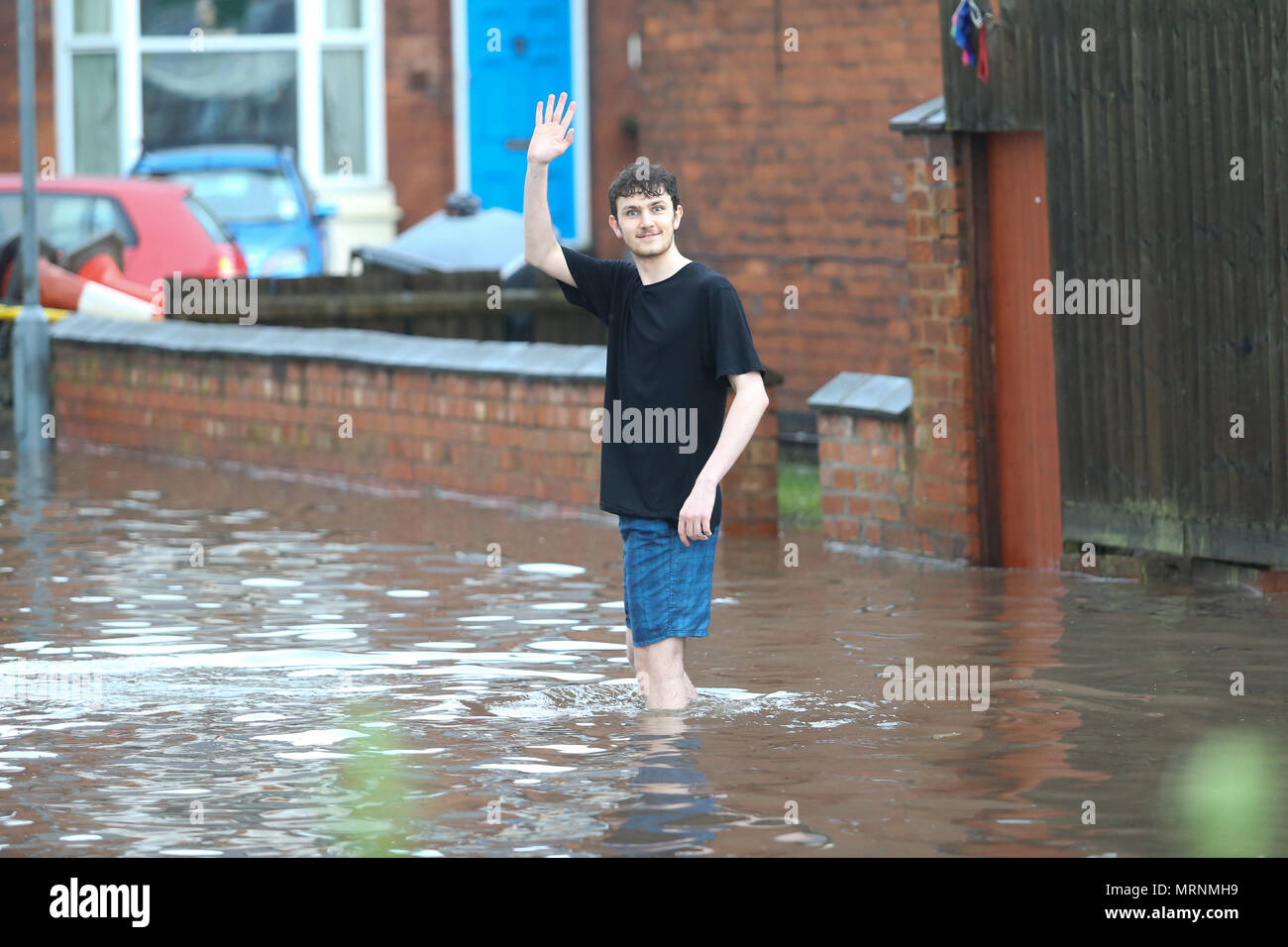 People walking through flood water, Birmingham UK Stock Photo - Alamy
