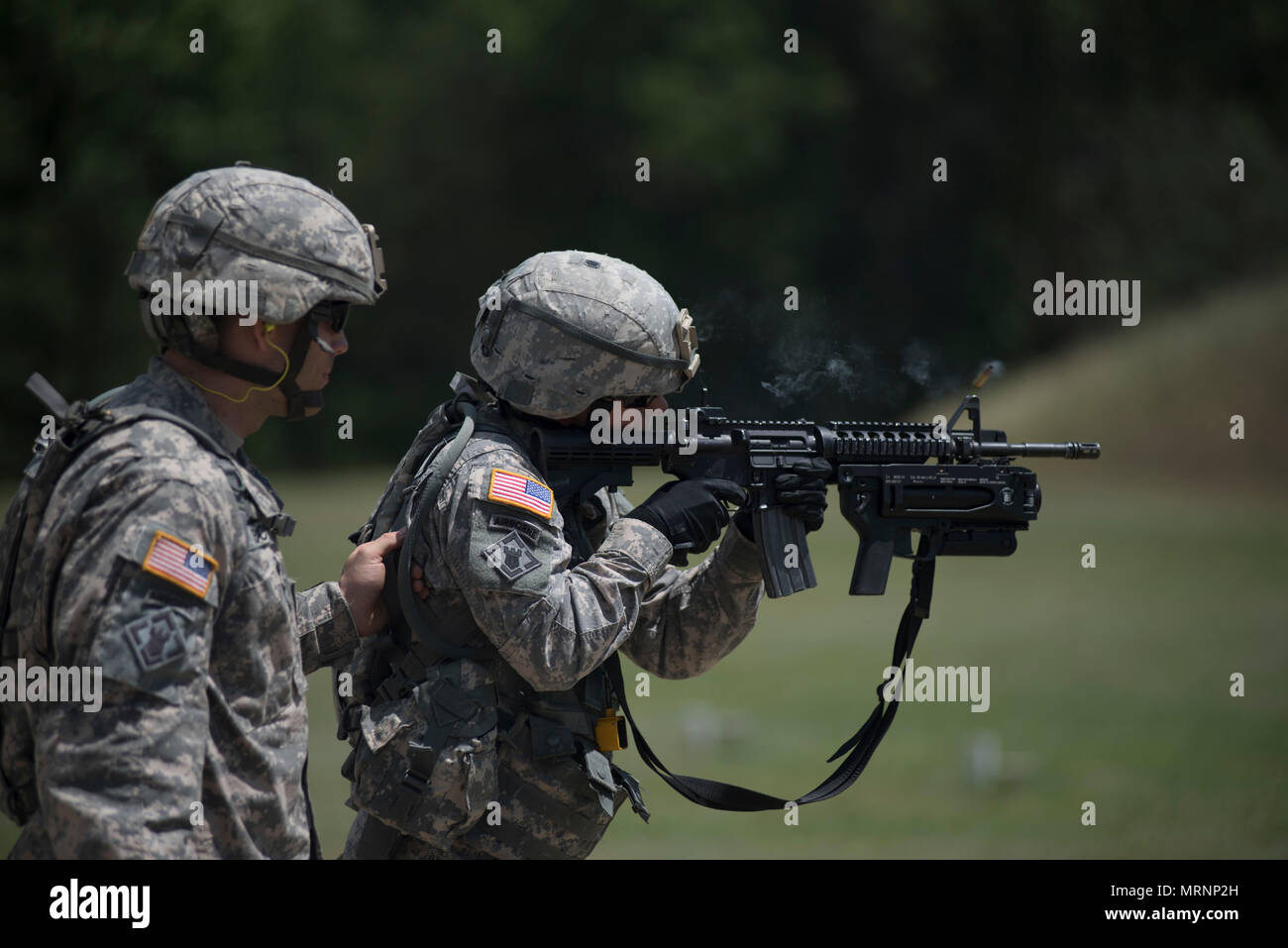 A smoking case from a 5.56mm round flies out of an M4 during reflexive ...