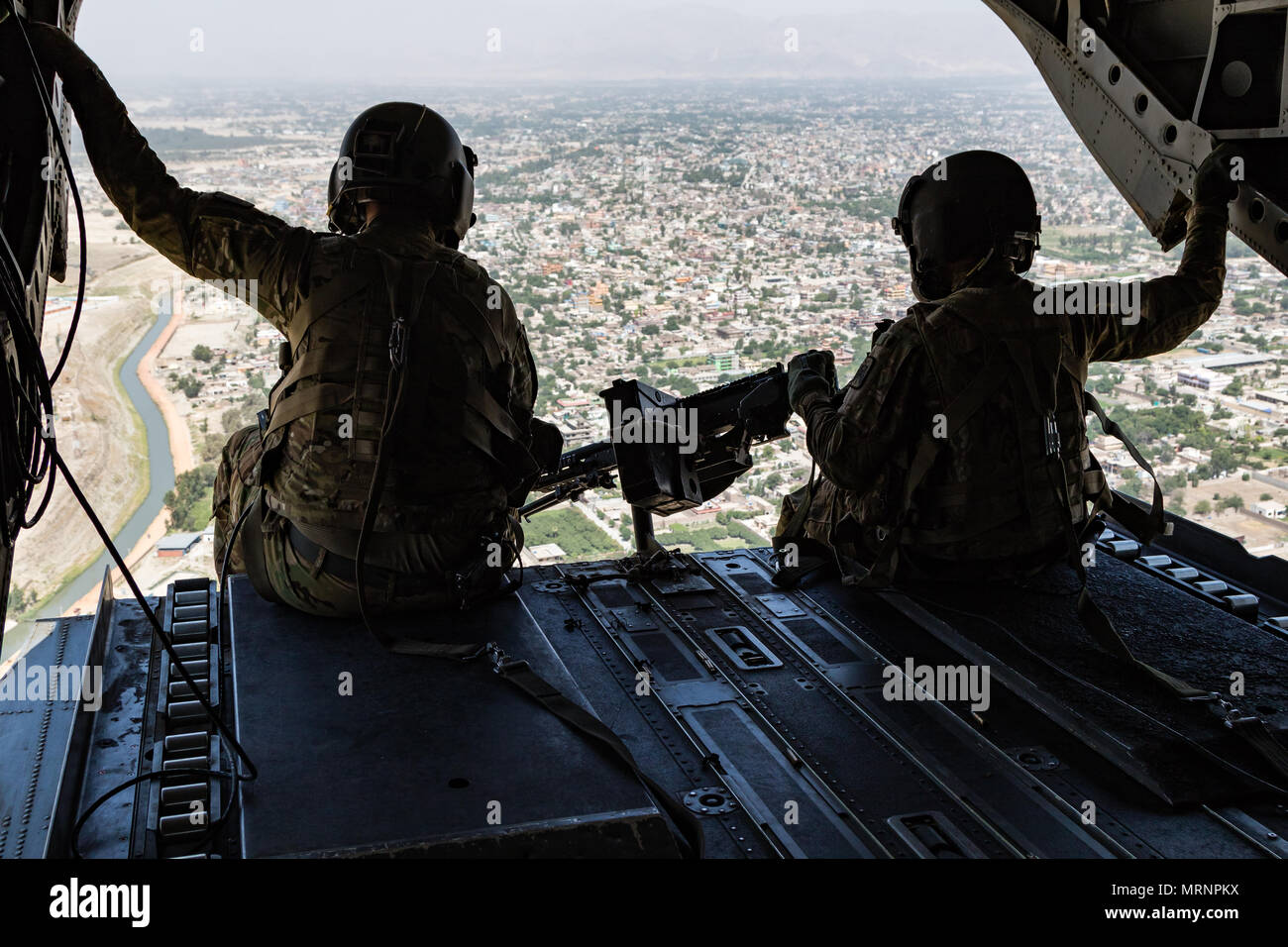 U.S. Army CH-47 Chinook helicopter crew chiefs assigned to Task Force ...