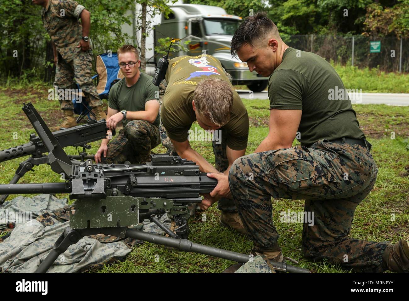 U.S. Marine Corps Cpl. Johnathan A. Hance, left, Headquarters Company ...