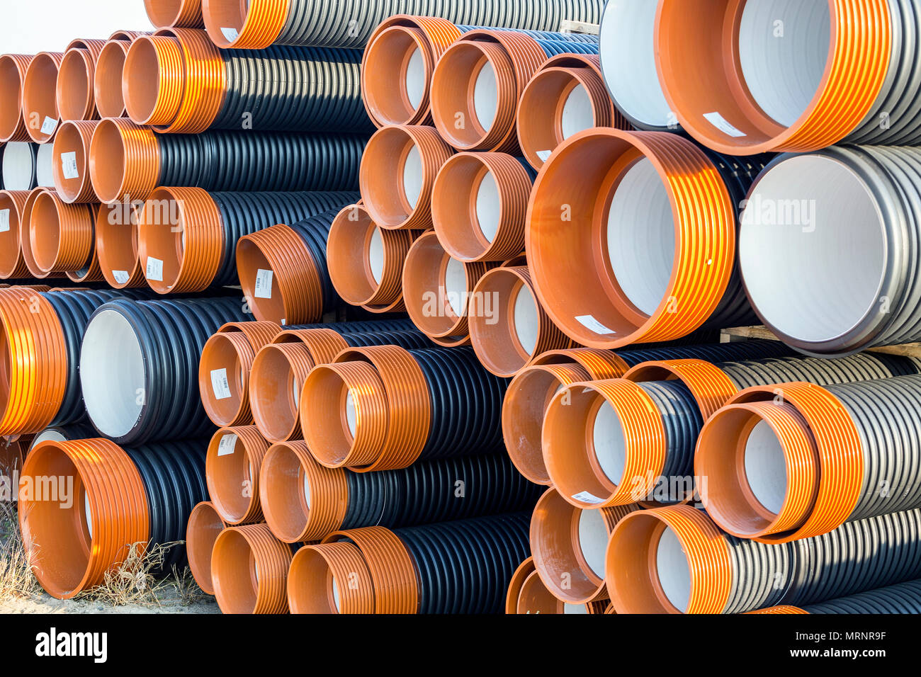 Pile of corrugated PVC seweror drain pipes of large diameter with dual ...