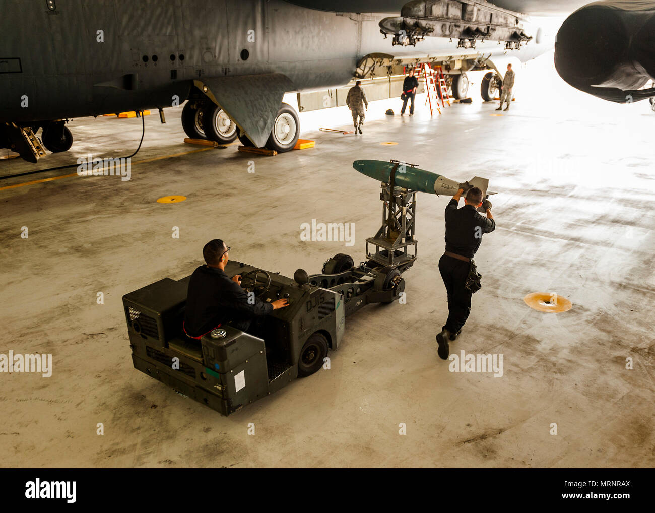 Airmen from the 5th Aircraft Maintenance Squadron Global Strike Challenge team transport an ...