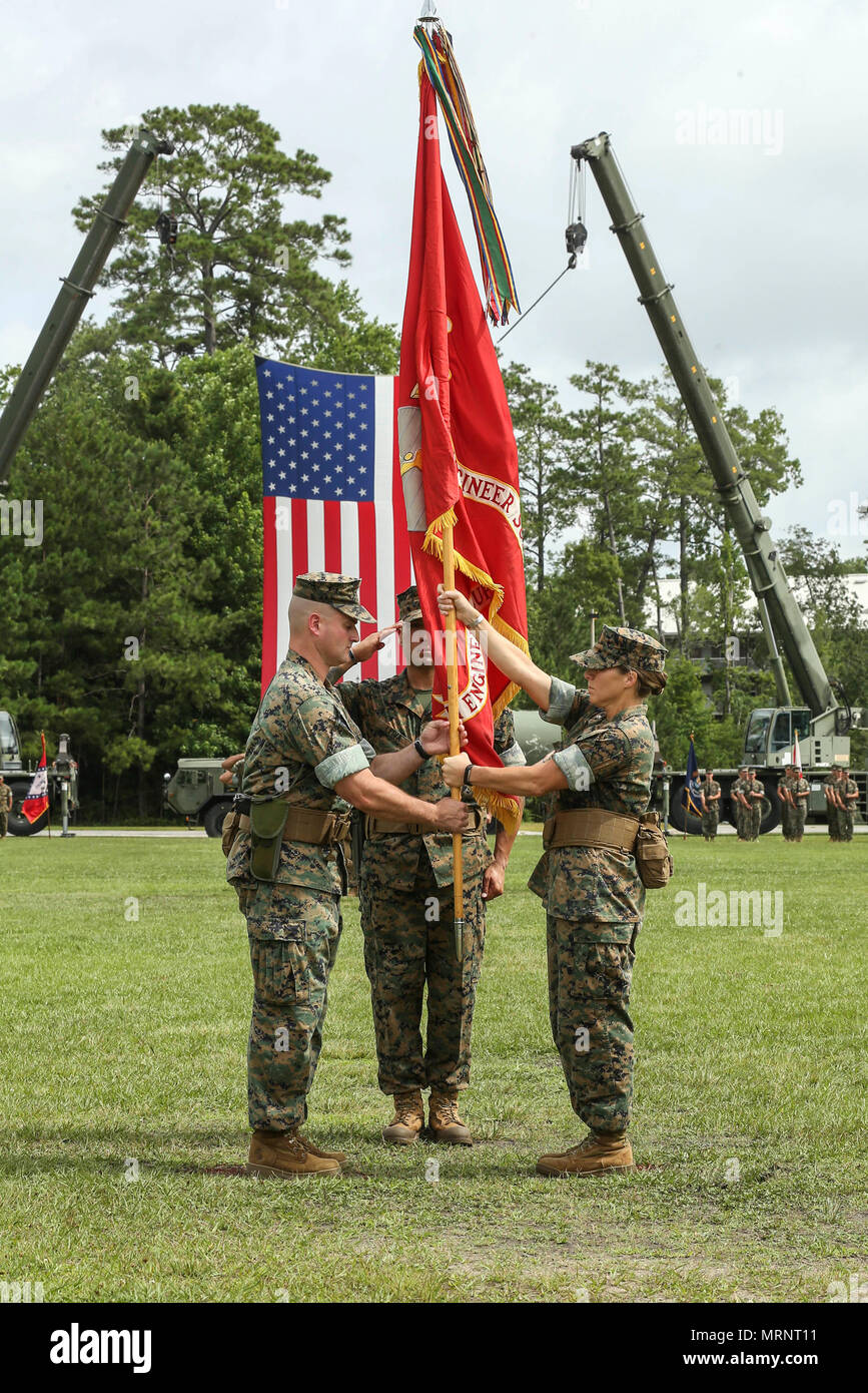 U.S. Marine Corps Lt. Col. Lauren S. Edwards, right, passes the Marine ...
