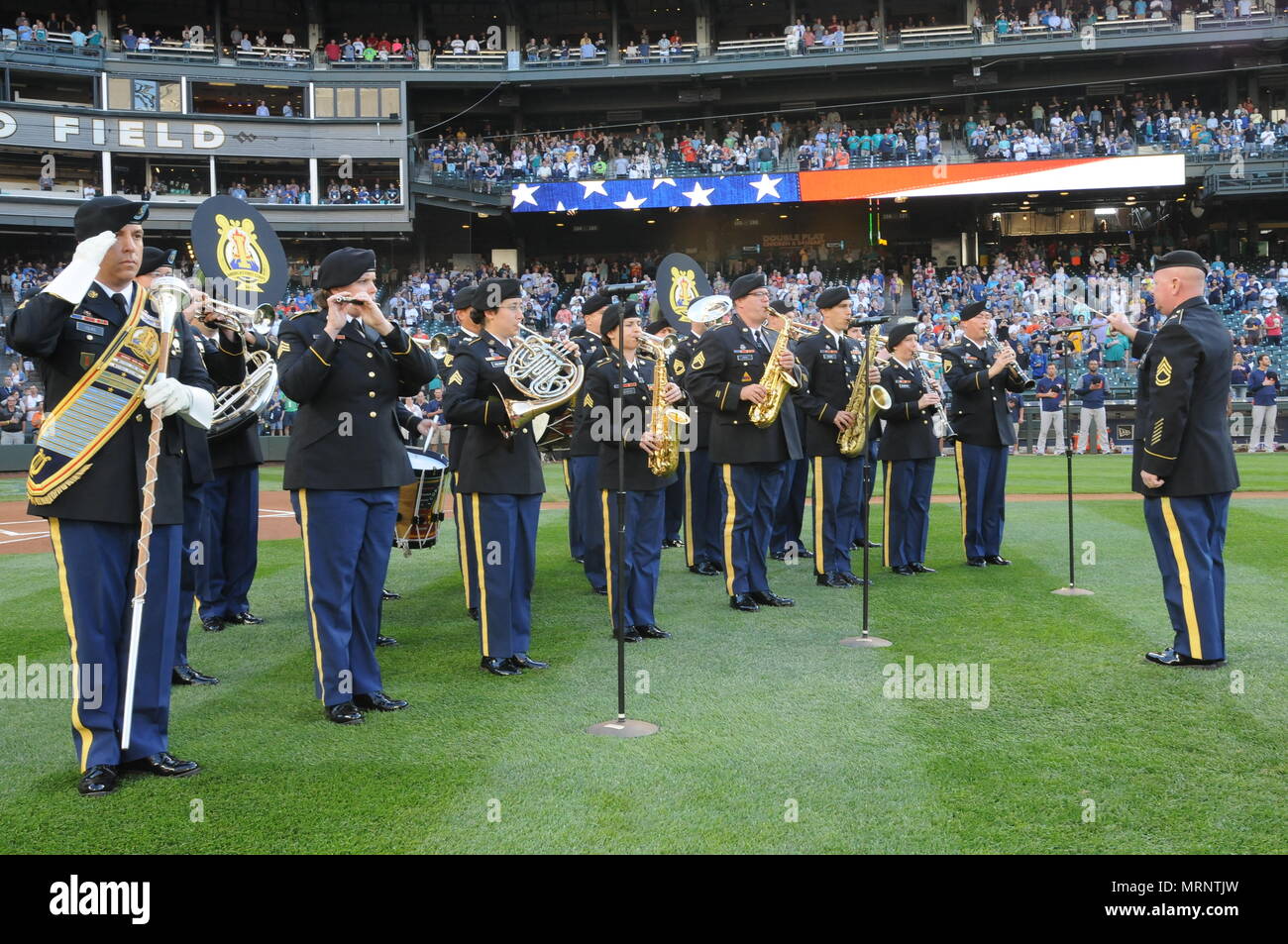 The 56th Army Band performing the national anthem before a Mariner’s ...