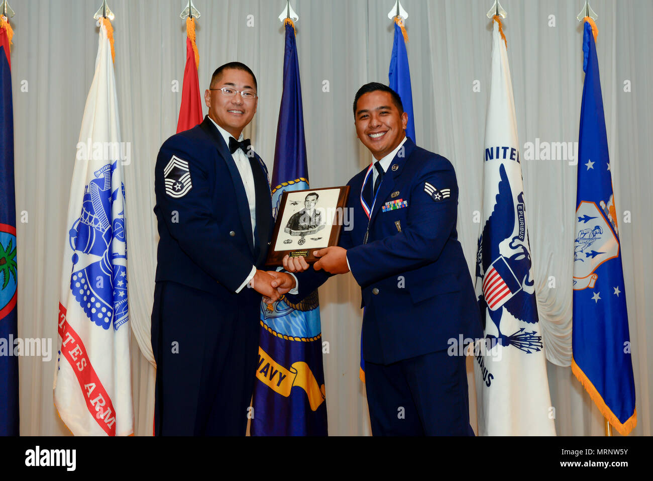 U.S. Air Force Senior Airman Jesus Babauta receives a distinguished ...