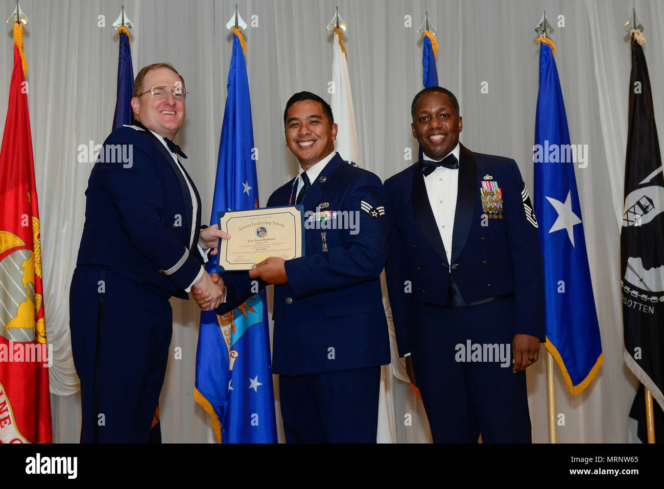 U.S. Air Force Senior Airman Jesus Babauta receives his graduation ...