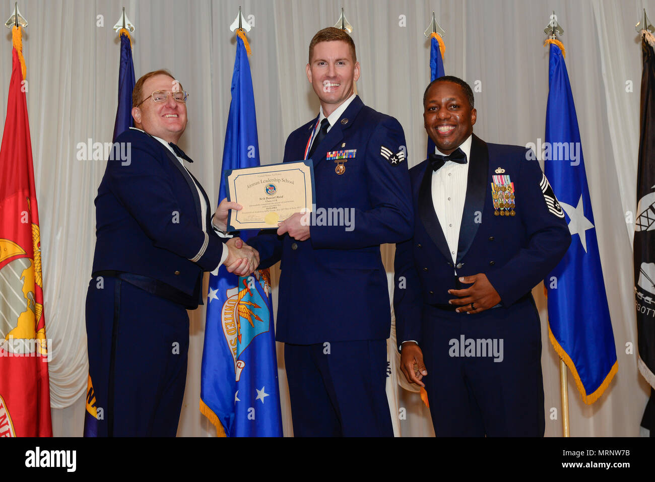 U.S. Air Force Senior Airman Daniel Reid receives his graduation ...