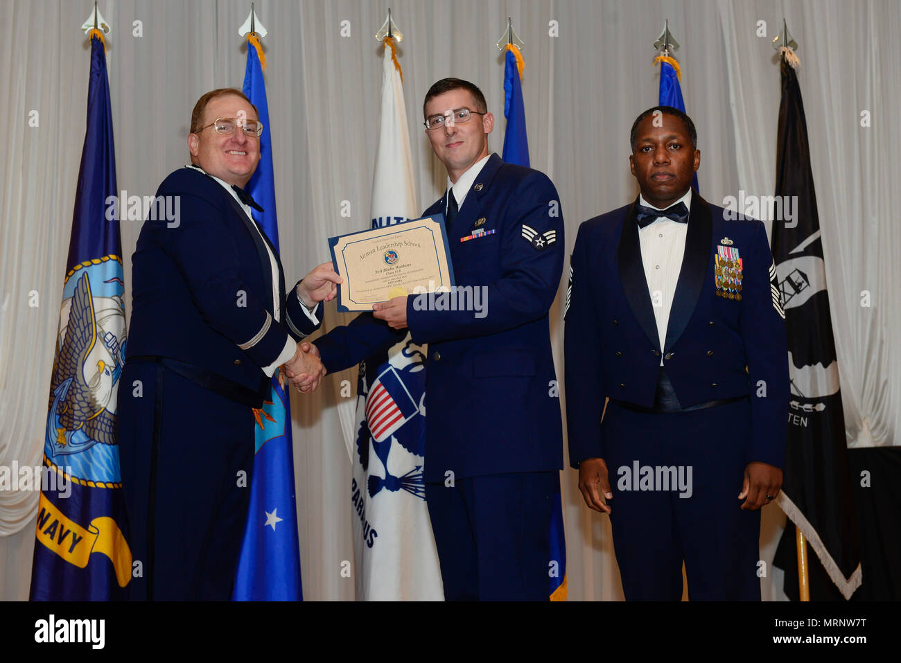 U.S. Air Force Senior Airman Blake Watkins receives his graduation ...