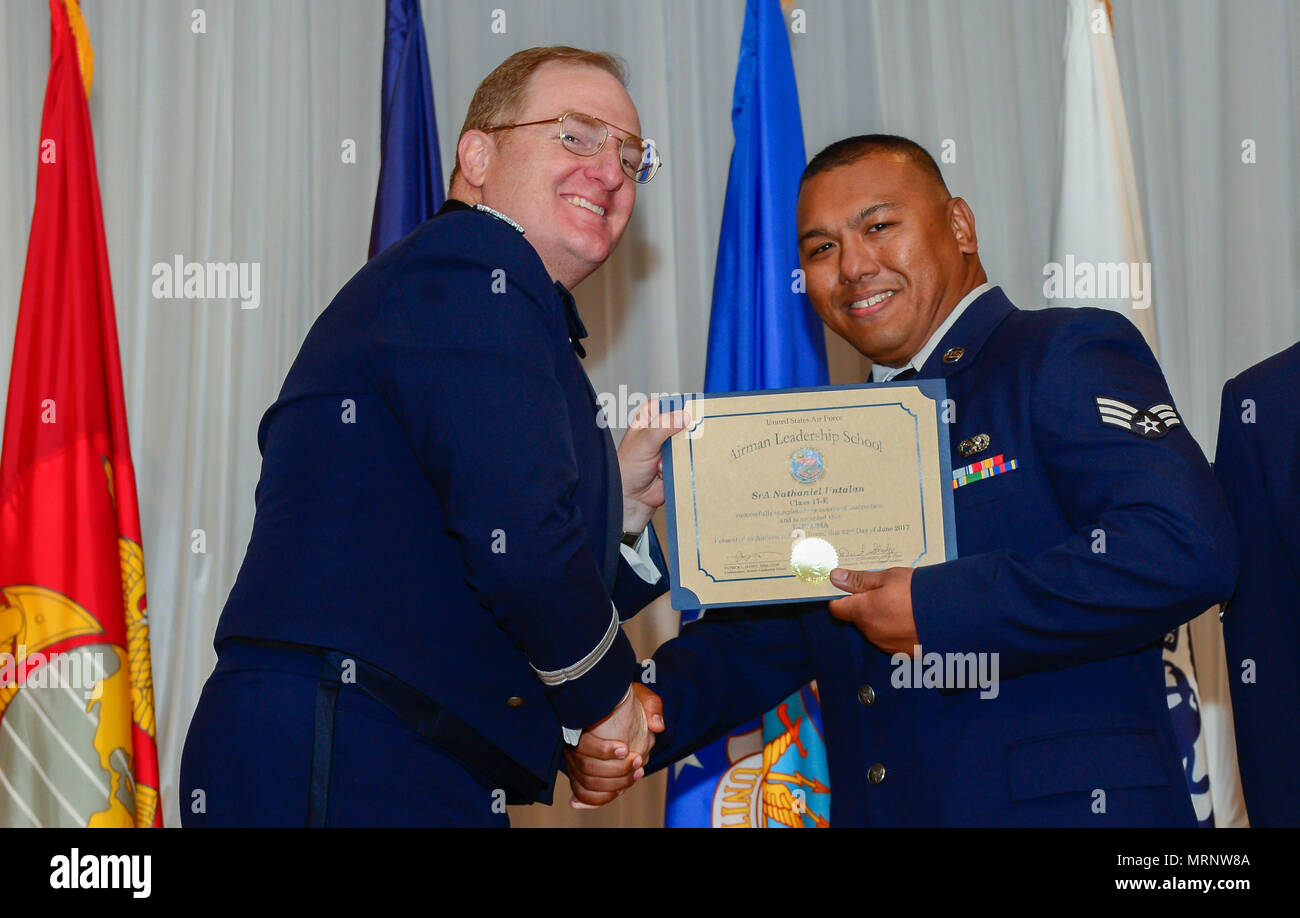 U.S. Air Force Senior Airman Nathaniel Untalan receives his graduation ...