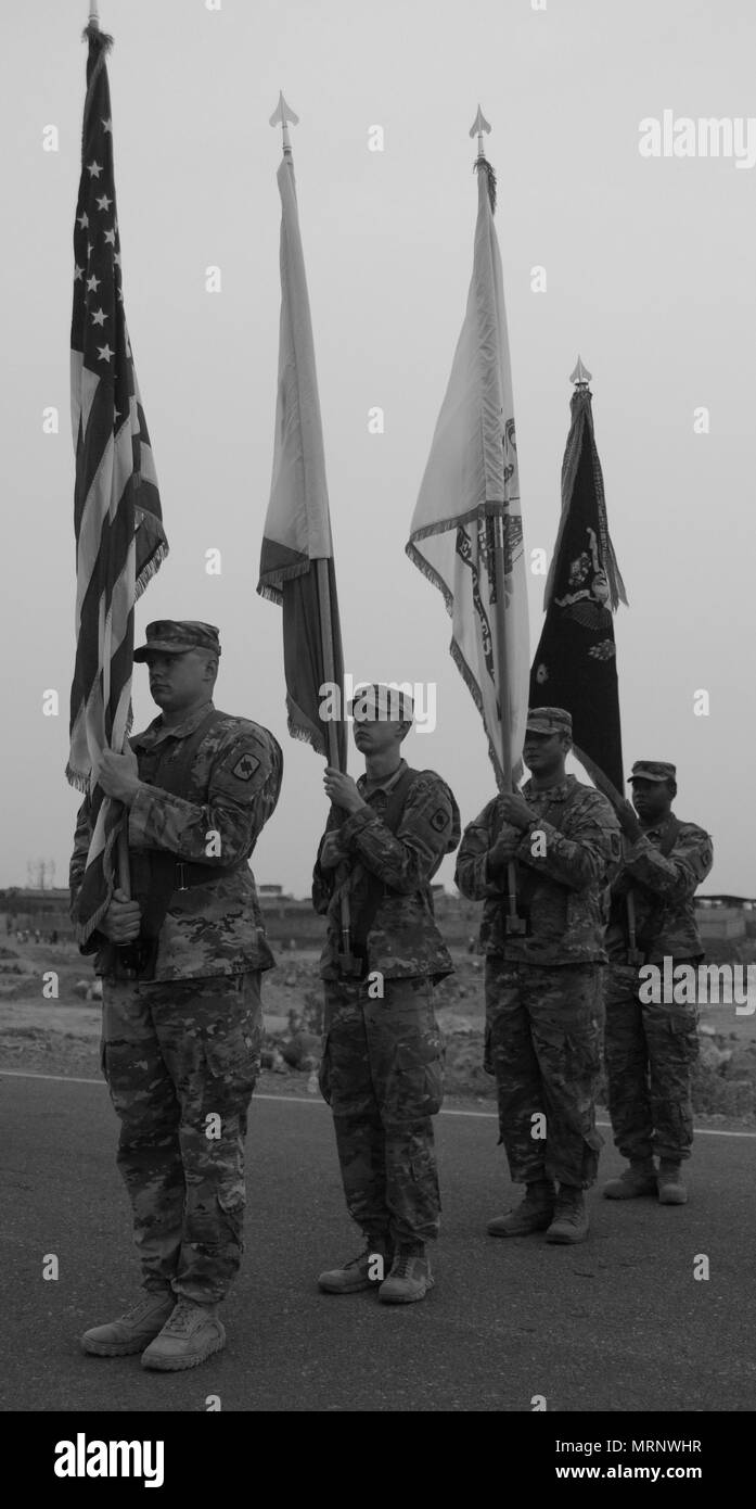 From left to right, Spc. Colton Sherrill carrying the American Flag ...