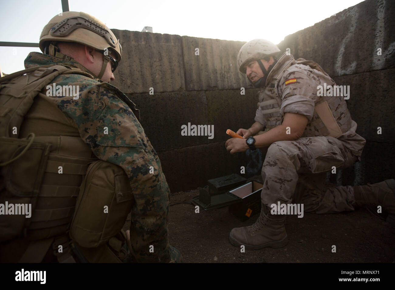 Warrant Officer Dan Pare, left, the explosive ordnance disposal officer ...