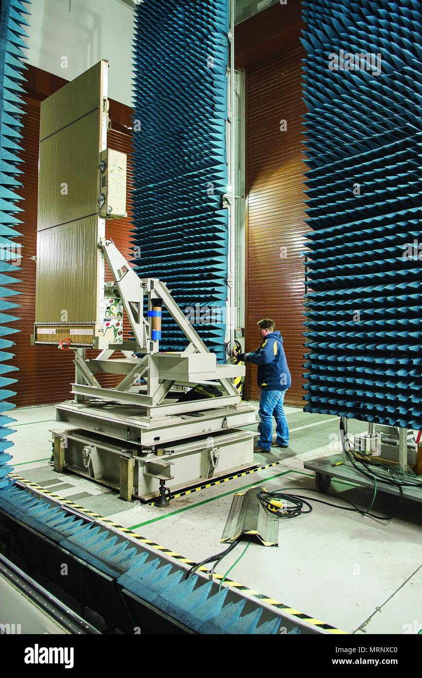 Electronics Mechanic Therese Paxton moves the radio frequency ...