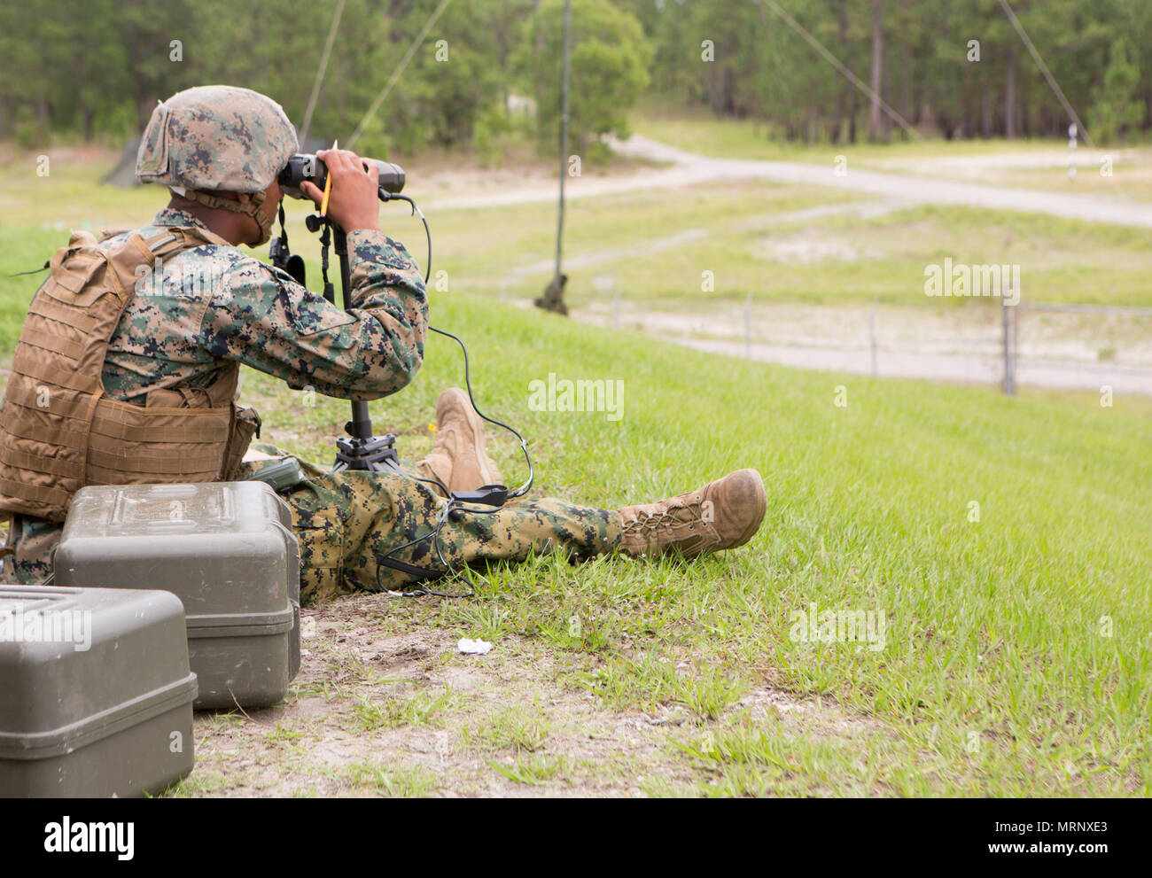 Lance Cpl. Benjamin Neely observes a target point during a training ...
