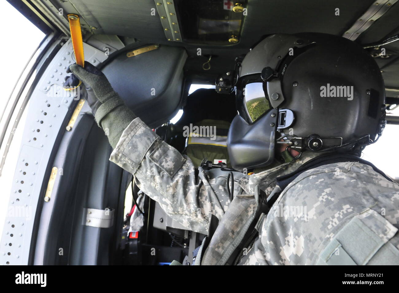 A crew chief assigned to the 2nd Battalion, 147th Assault Helicopter ...