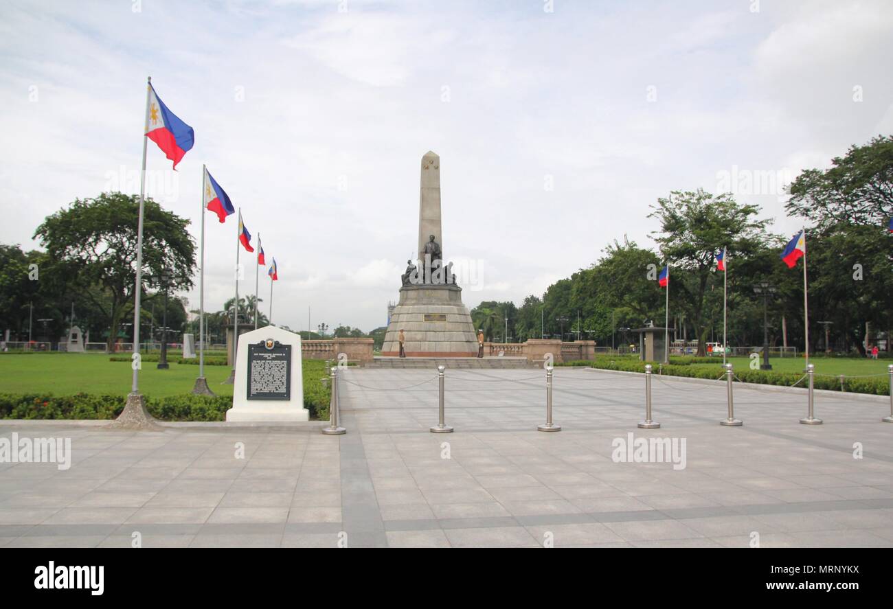 A monument of Philippine hero Dr Jose Rizal flanked by Philippine flags ...