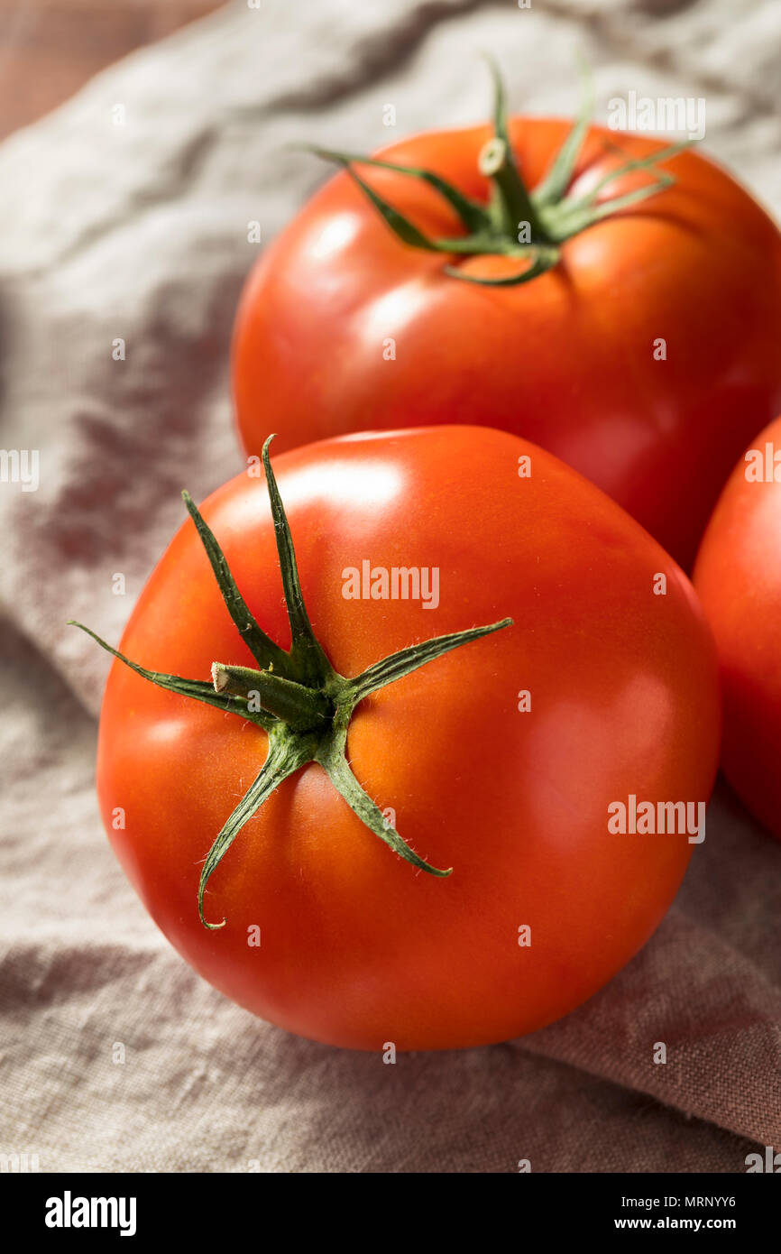 Raw Red Organic Tomatoes Ready to Cook Stock Photo - Alamy