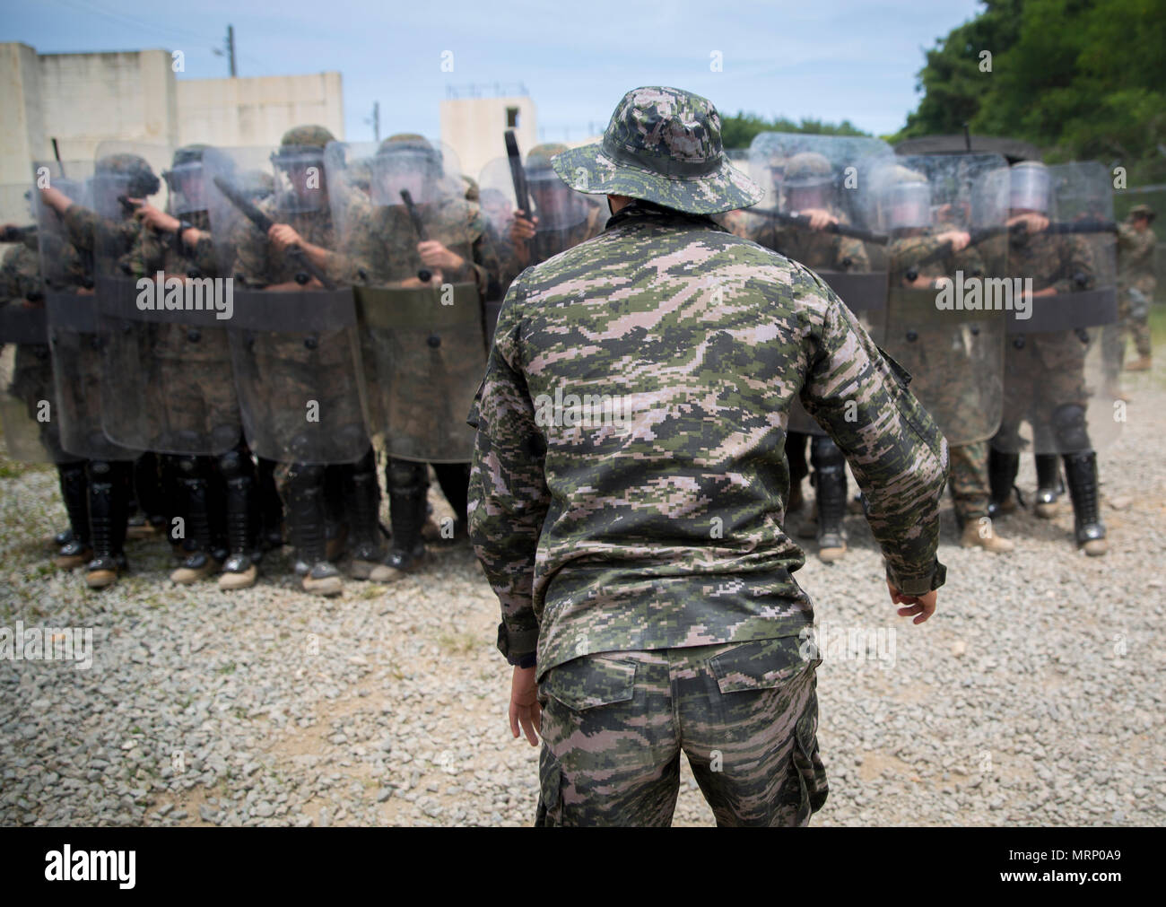 A Republic of Korea Marine attempts to break through a riot control ...
