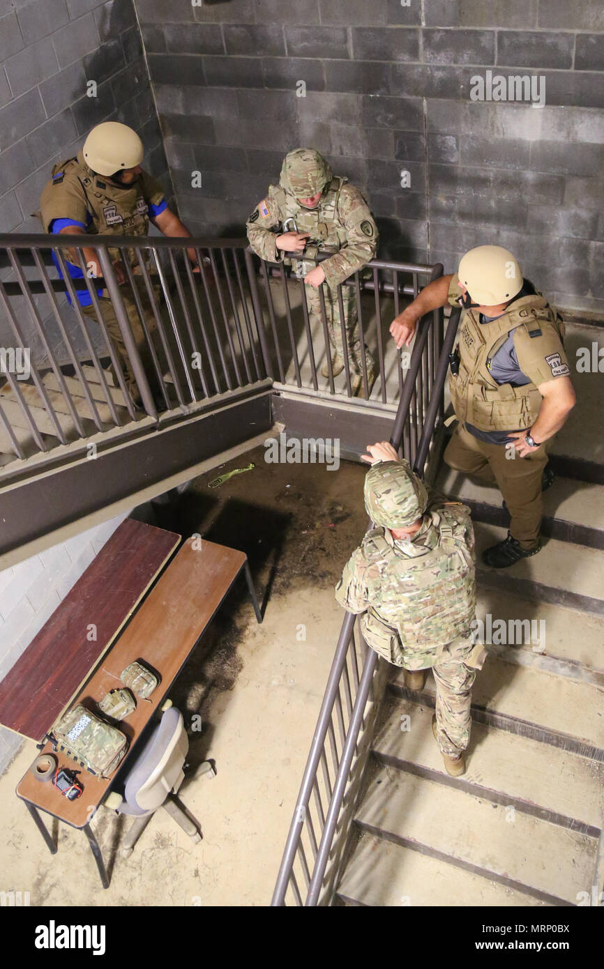 U.S. Soldiers assigned to 705th EOD Company, 63rd EOD Battalion, 52nd ...