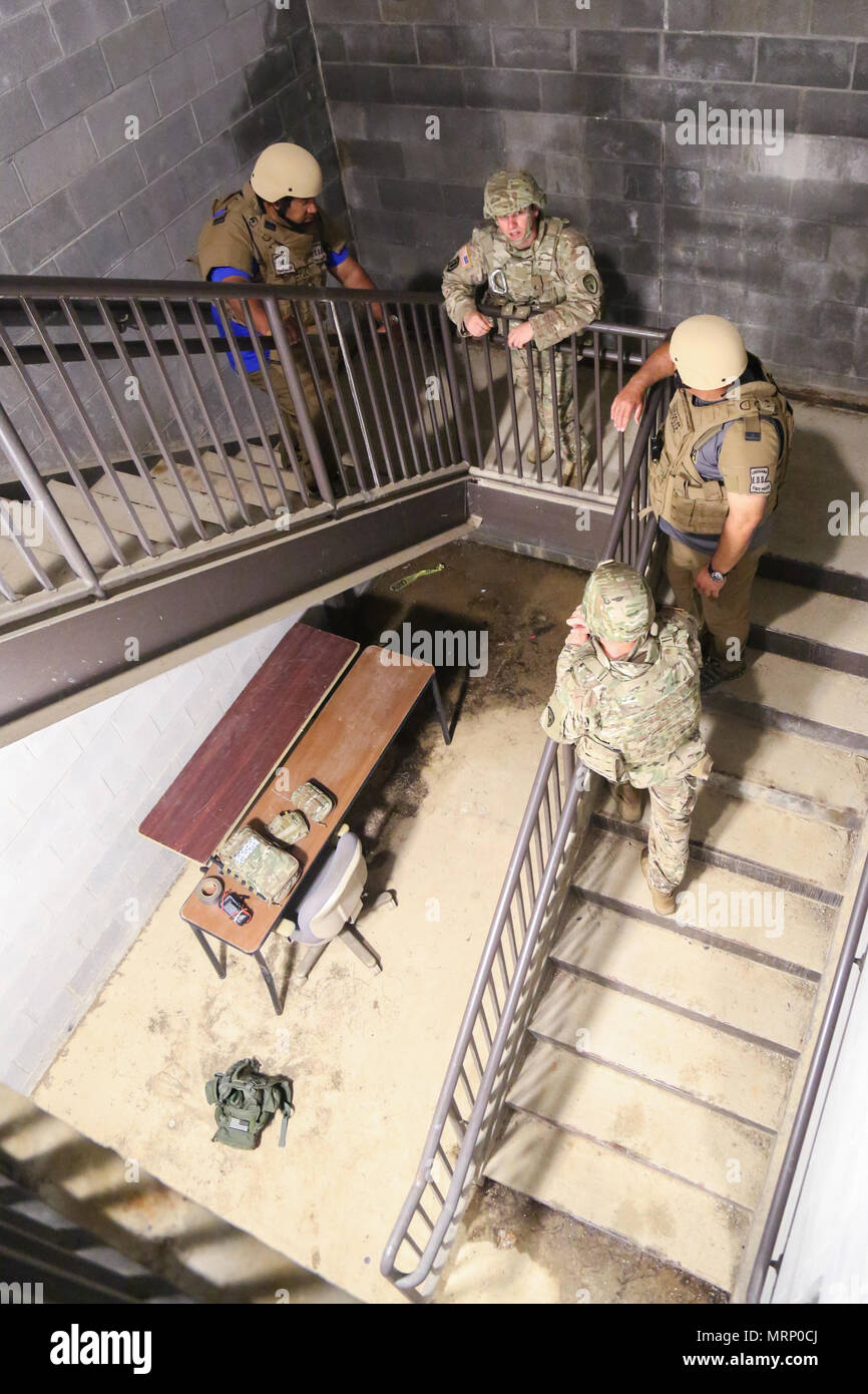 U.S. Soldiers assigned to 705th EOD Company, 63rd EOD Battalion, 52nd ...