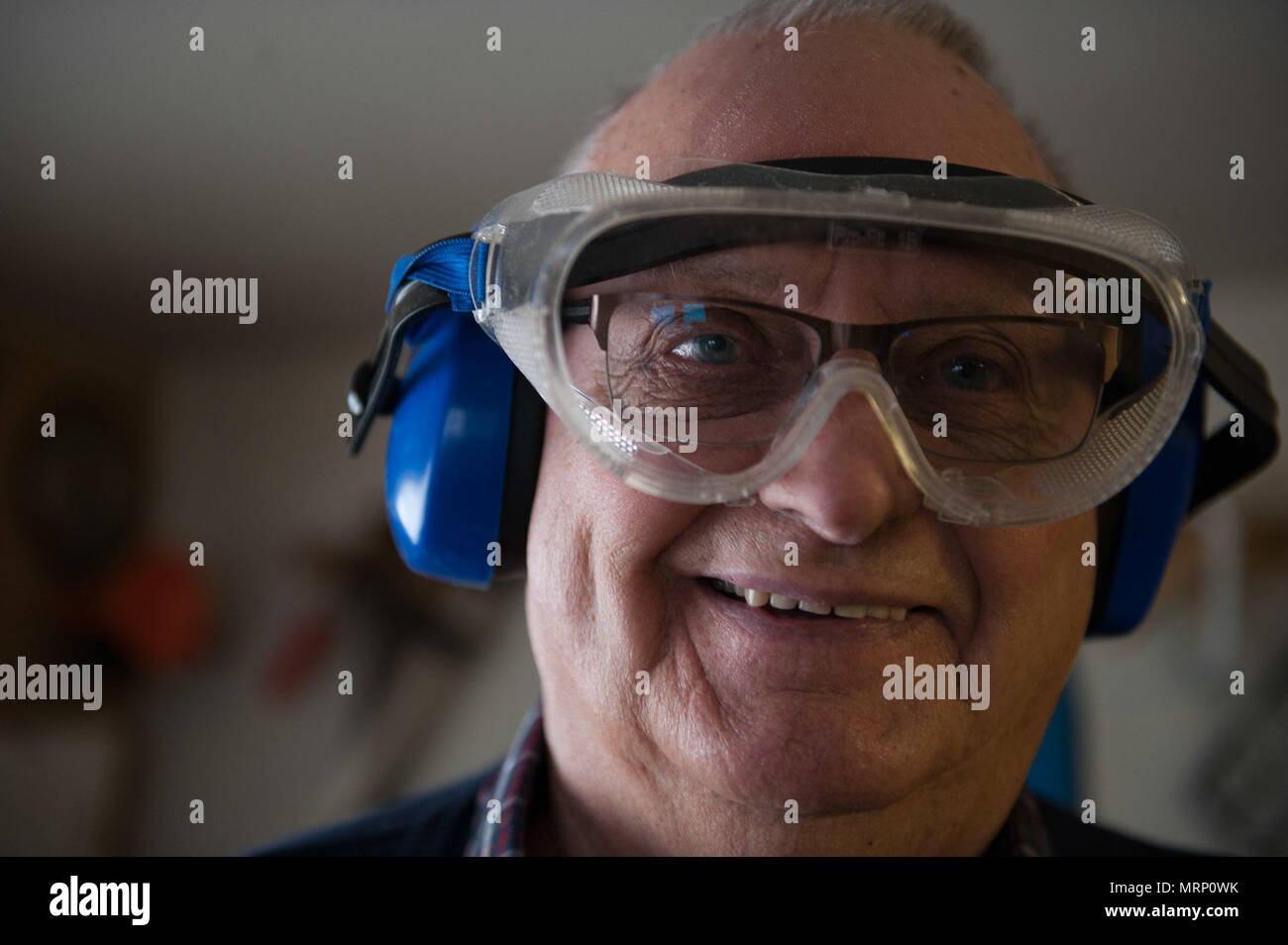 Retired Chief Master Sgt. Charles E. Milam smiles while working in his ...
