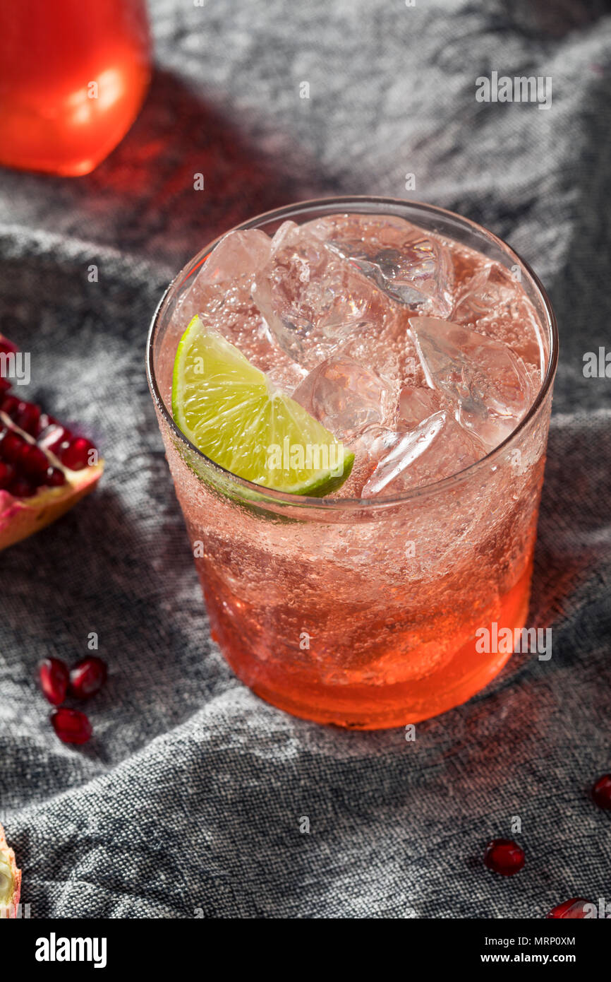 Sweet Homemade Pomegranate Grenadine Cocktail with Lime Stock Photo - Alamy