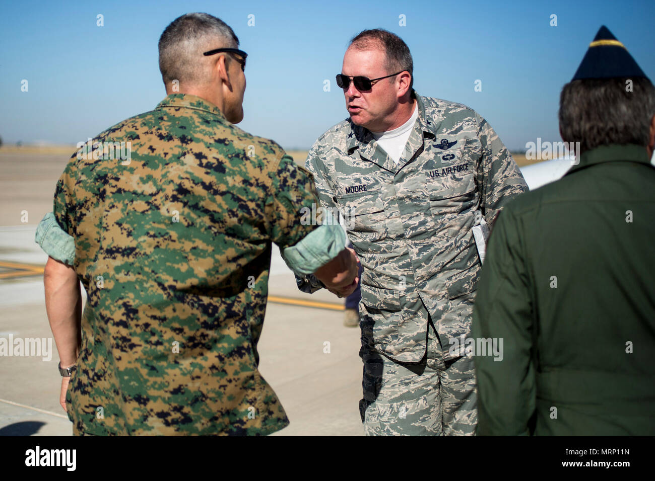 Brig. Gen. Richard D. Moore, center, the commander of the 86th Airlift ...