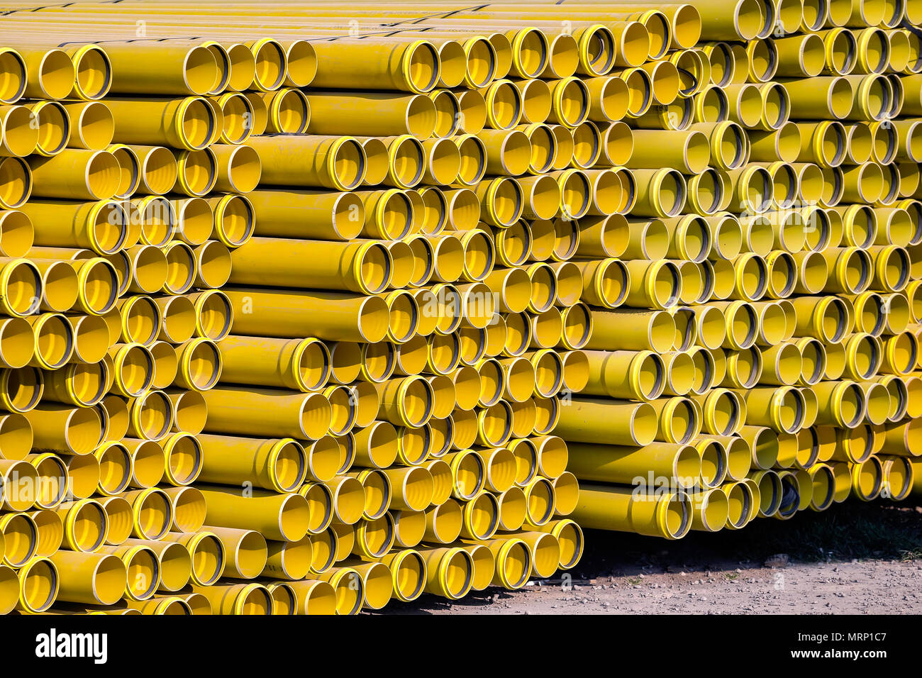 Stack of pvc pipes background at construction site. Selective focus ...