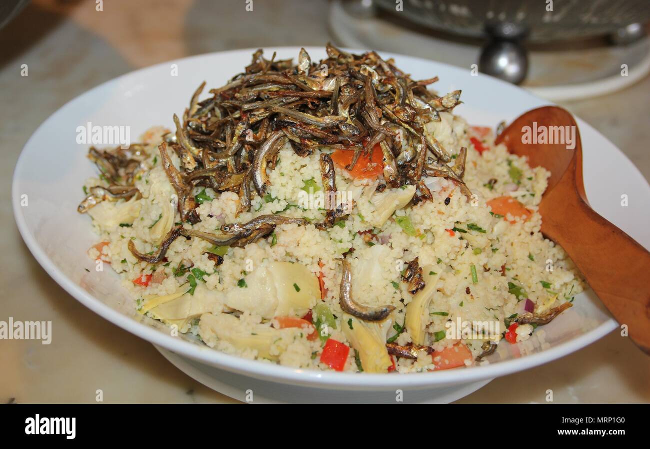 Fried rice, vegetable salad and small fish or anchovy is one of the ...
