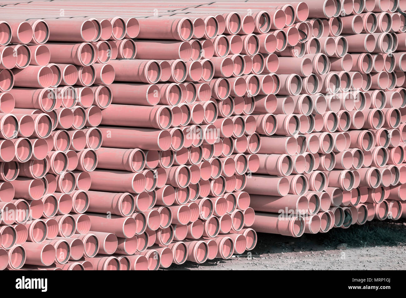 Stack of pvc pipes background at construction site. Selective focus ...