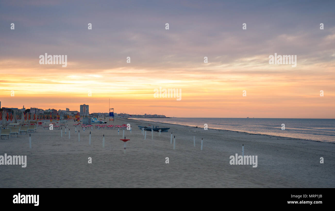 Typical beach of the Romagna Riviera at sunset, Italy Stock Photo - Alamy