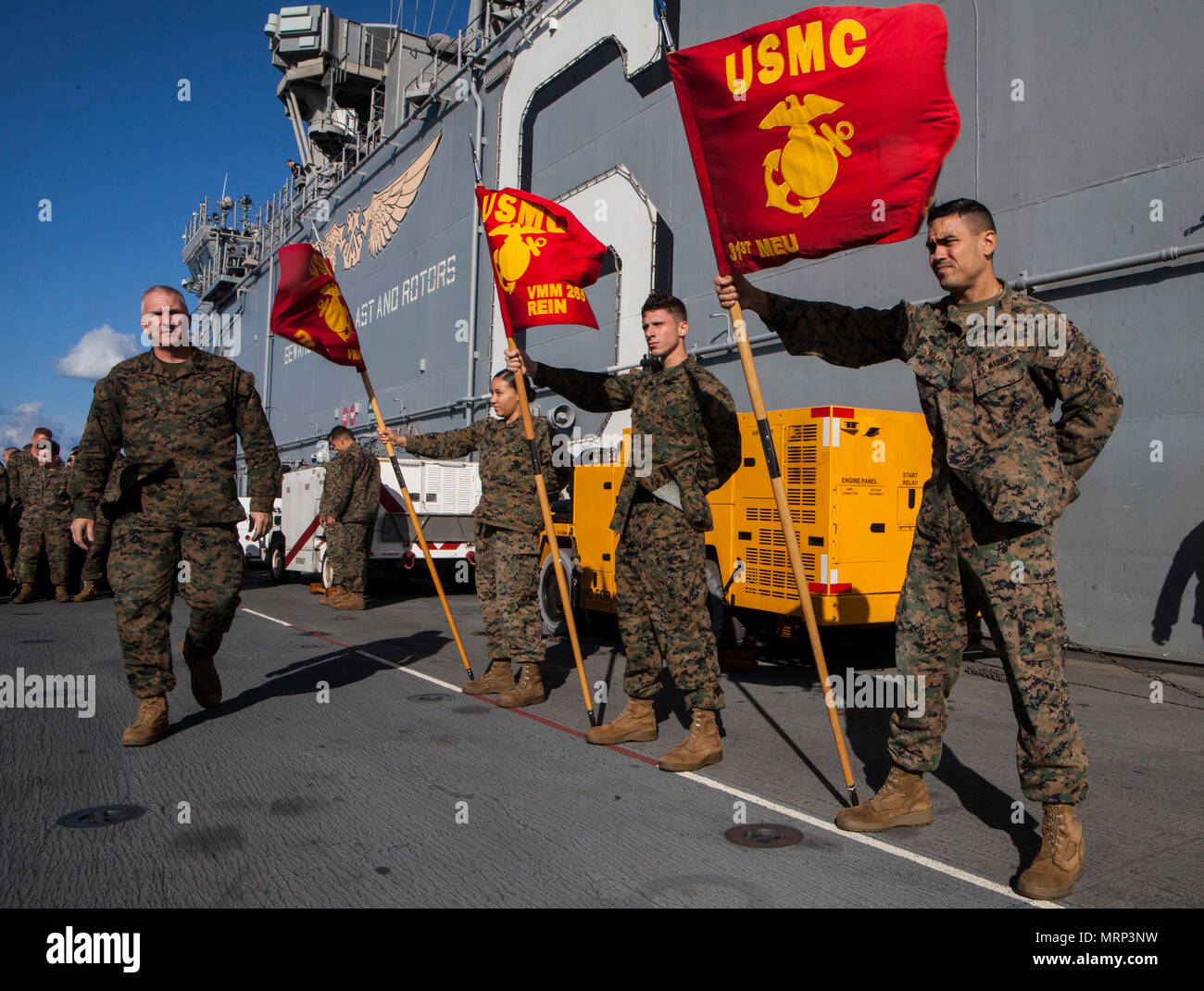Marines with the 31st Marine Corps Expeditionary Unit hold guidons ...
