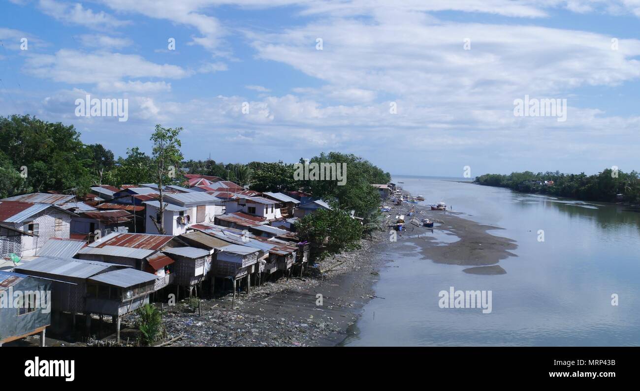 Houses on stilts by Bangkerohan River, Davao City Stock Photo - Alamy
