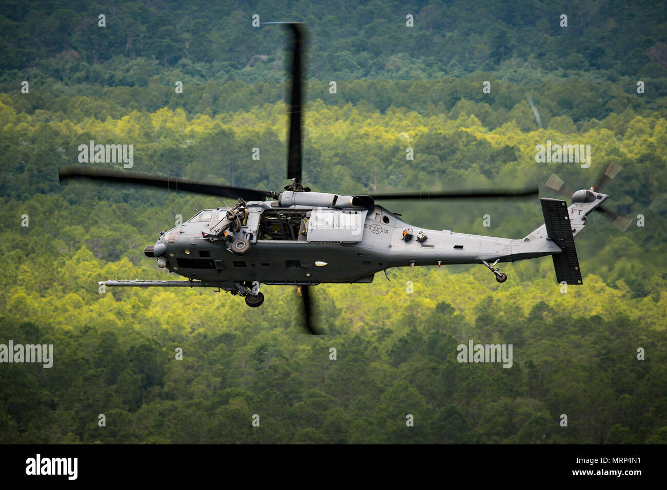 An HH-60G Pave Hawk from the 41st Rescue Squadron flies over Grand Bay ...