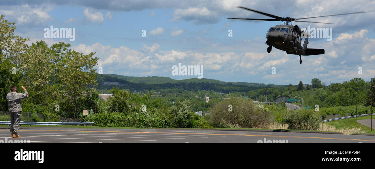 Capt. Richard LaGrega, Connecticut National Guard, lands a UH-60 Black ...