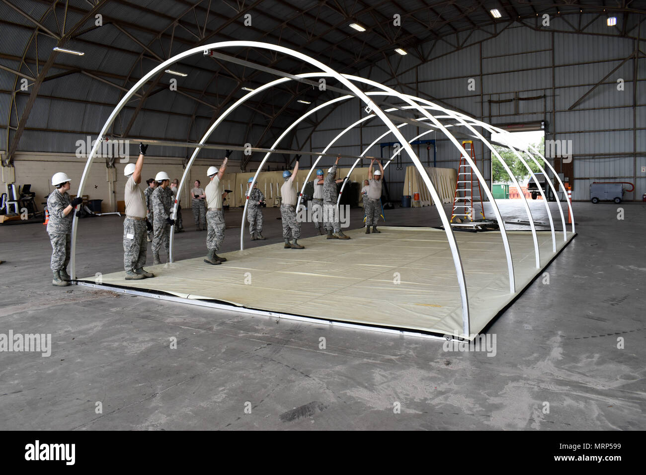 134th Services Flight construct temper tent during an annual training ...
