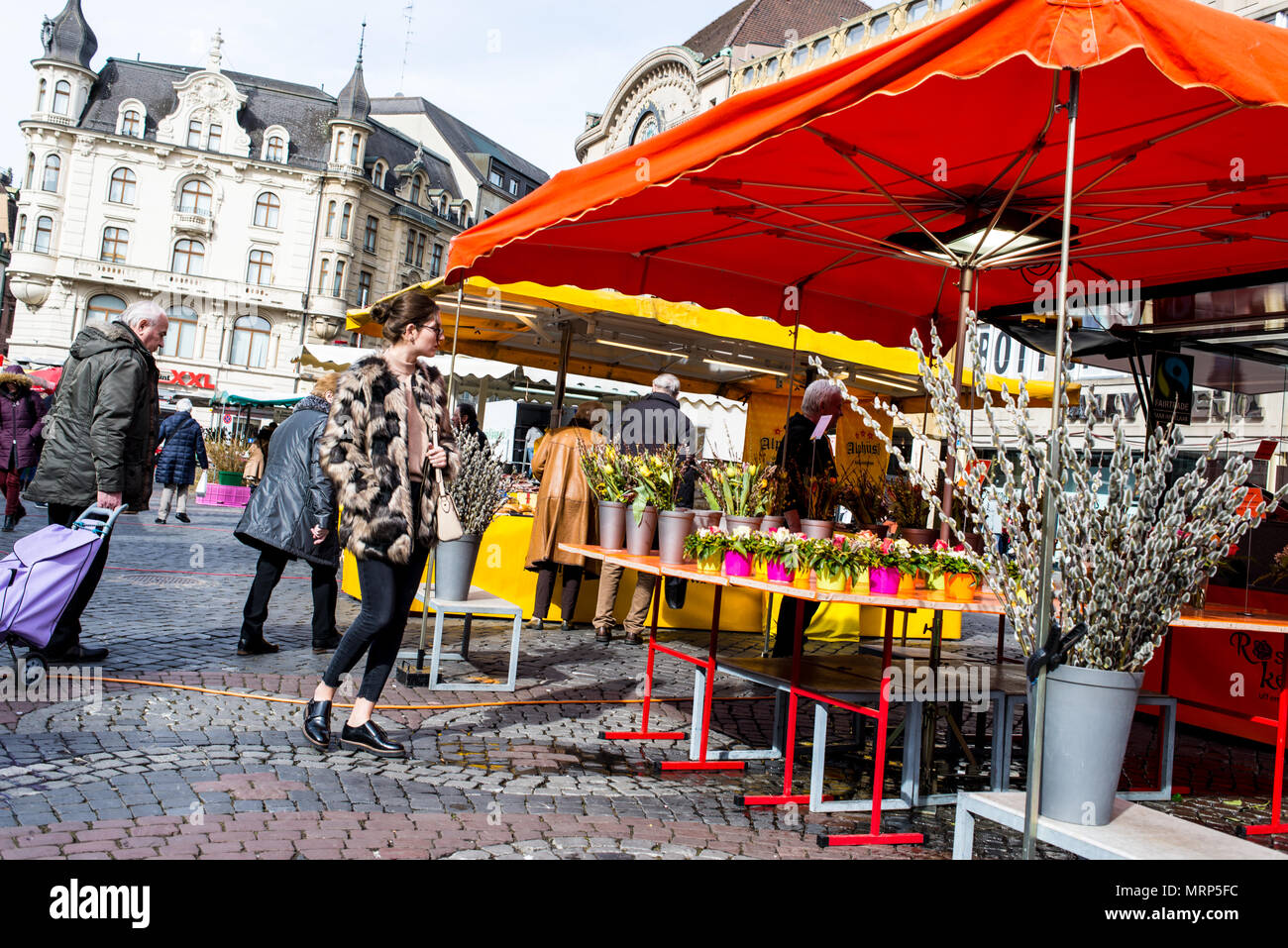 People walking among stalls in Market Square or Marktplatz, the main ...