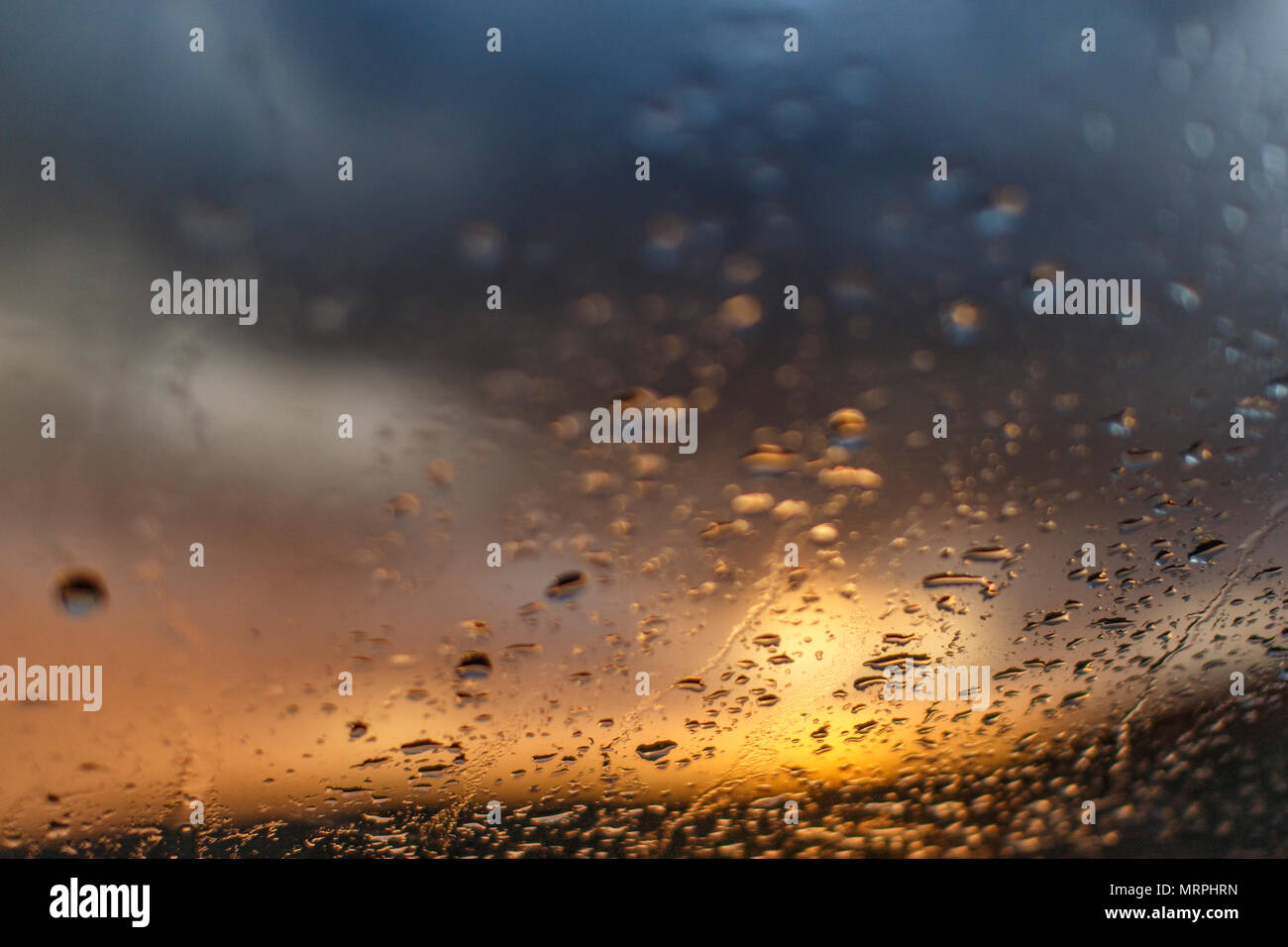 sunset on rainy day through window Stock Photo - Alamy