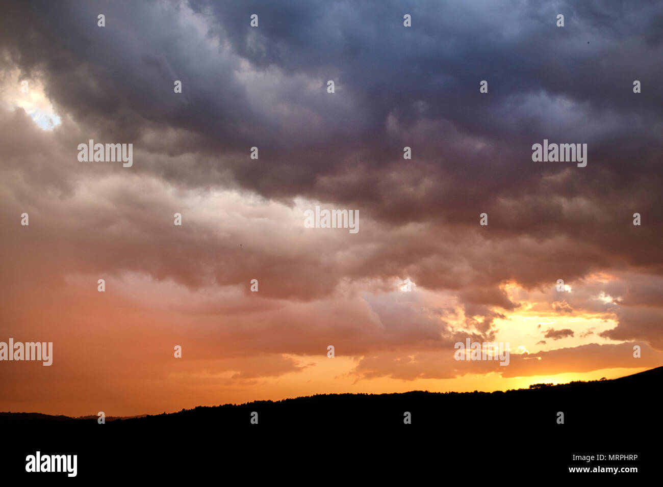 colorful and cloudy sunset Stock Photo - Alamy