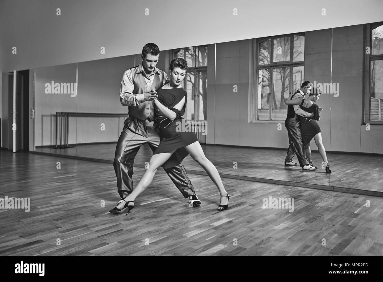 Attractive male and female dancing tango Black and White Stock Photos & Images - Alamy