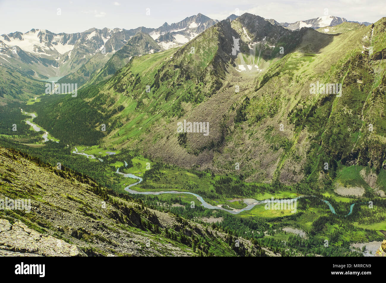 Top view of the valley between the high mountains in which flows a ...