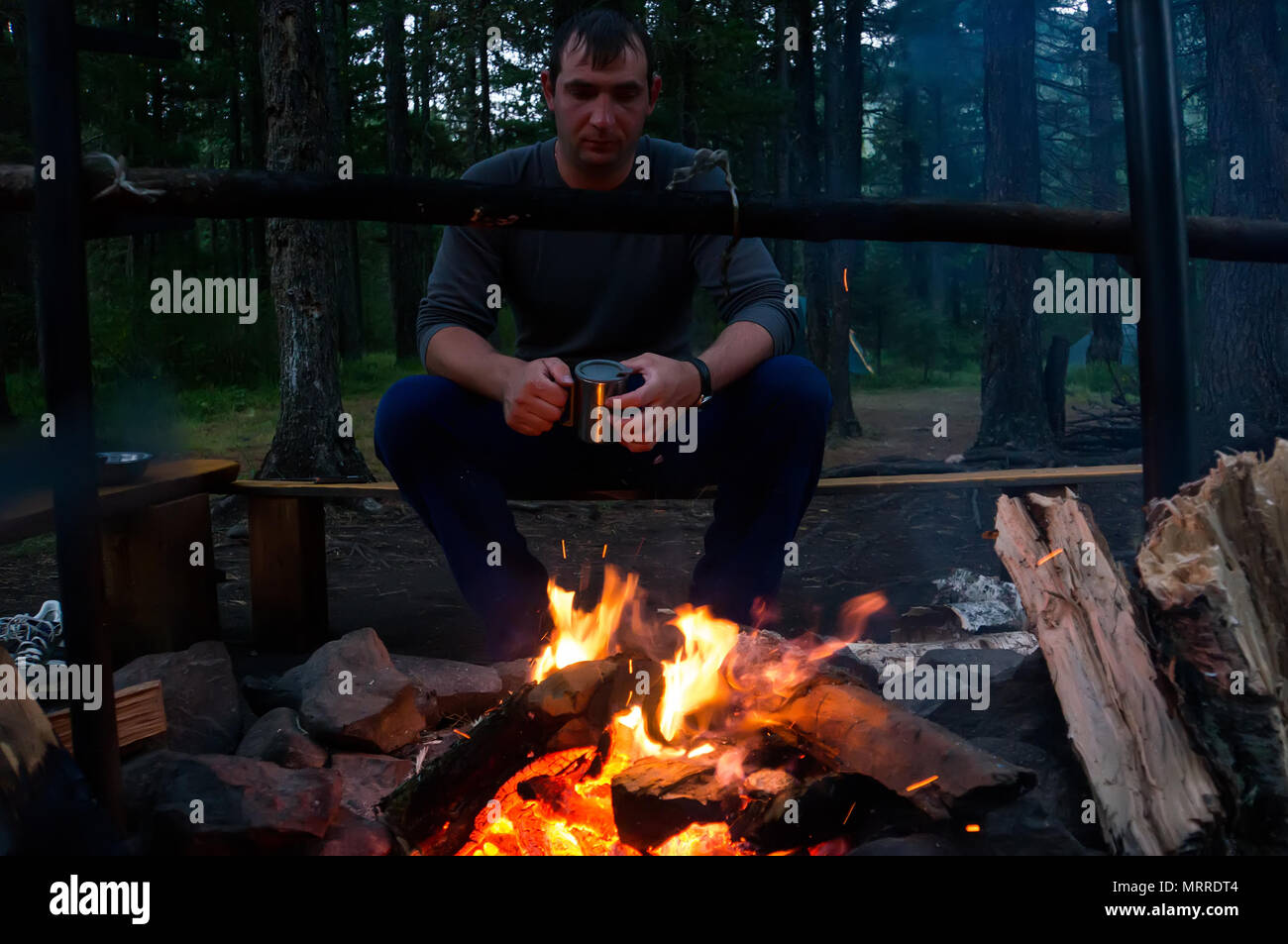 Man sitting fire drink hi-res stock photography and images - Alamy