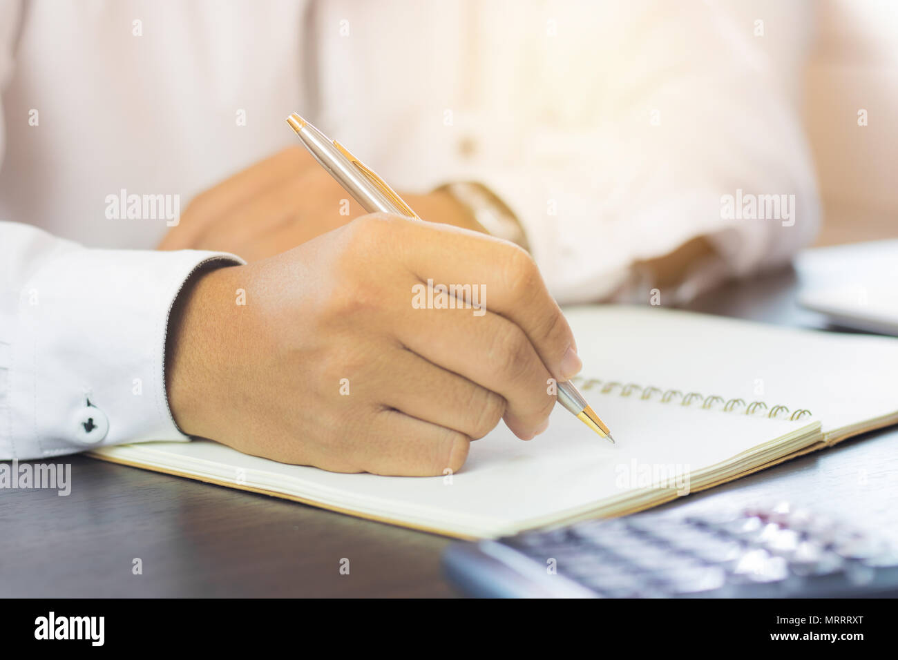 hand writing on notebook in dark tone Stock Photo - Alamy