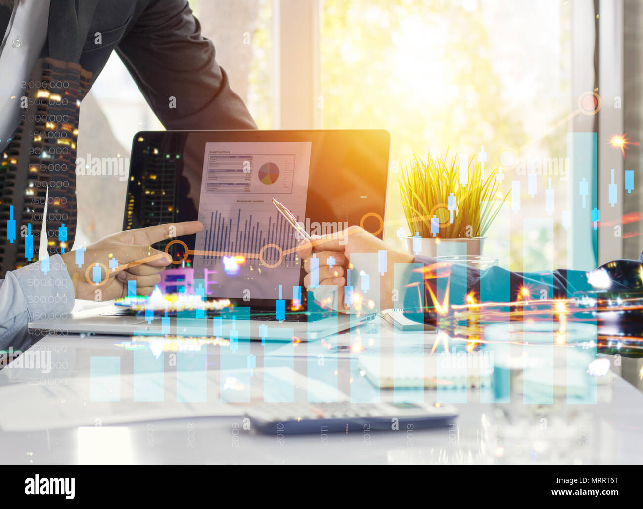 Meeting and planning concept, businessman pointing at graph on laptop ...