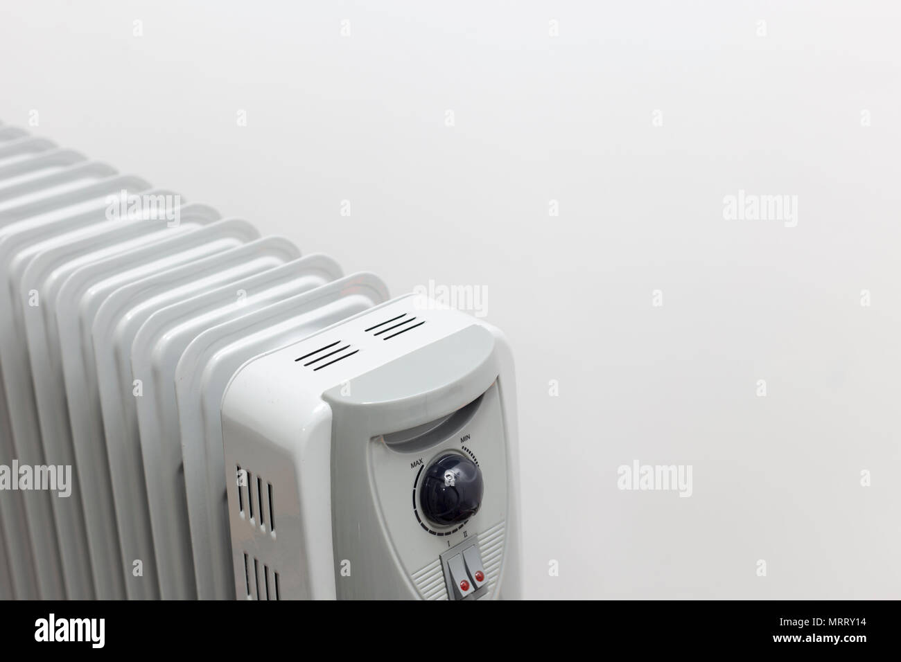 View from above at oil electric radiator heater on white background ...