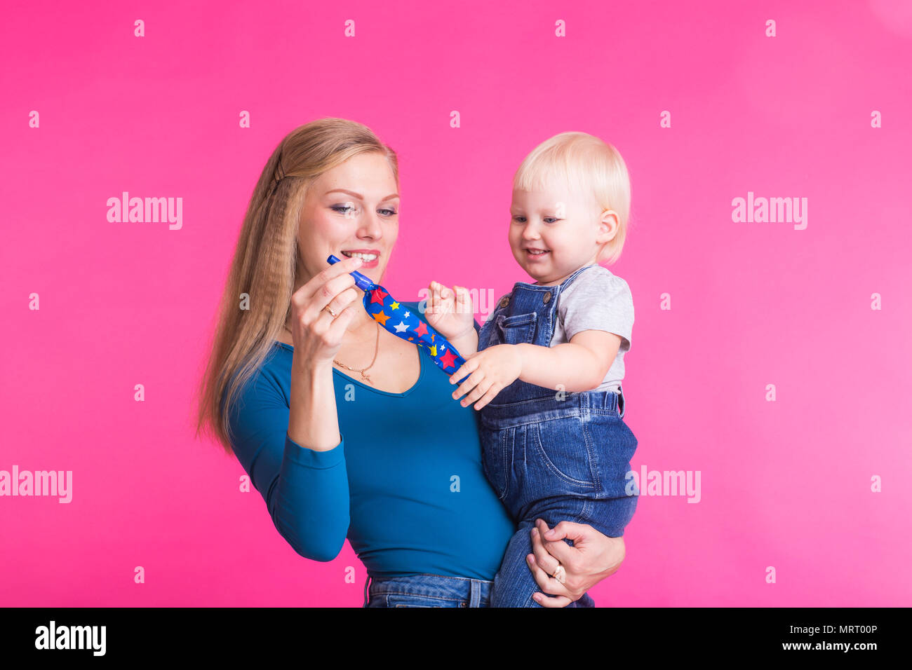 mother and daughter having fun isolated on pink background Stock Photo ...