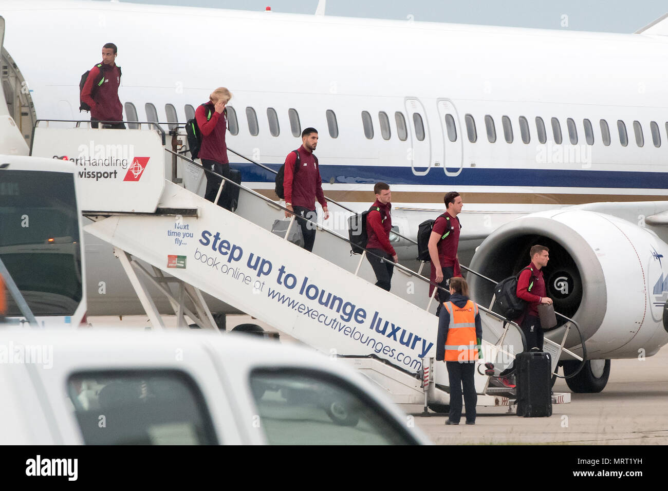 Liverpool players get off the plane at John Lennon Airport after defeat ...